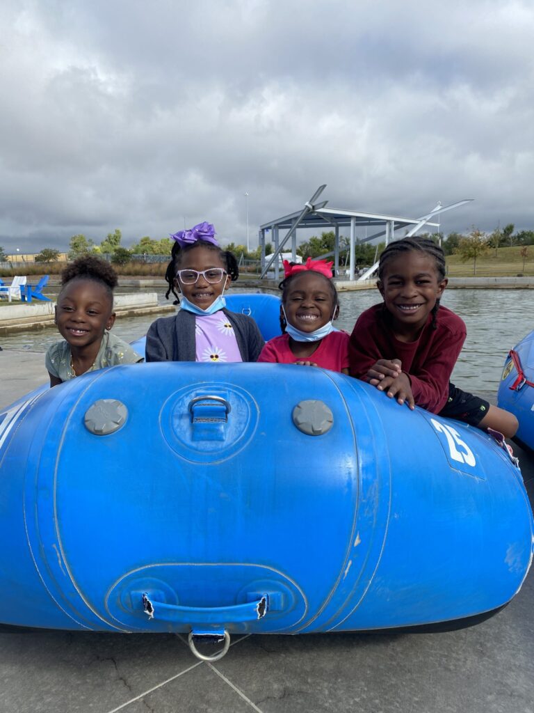 2021 Thrive Outside Day kids in raft - Outdoor Industry Association